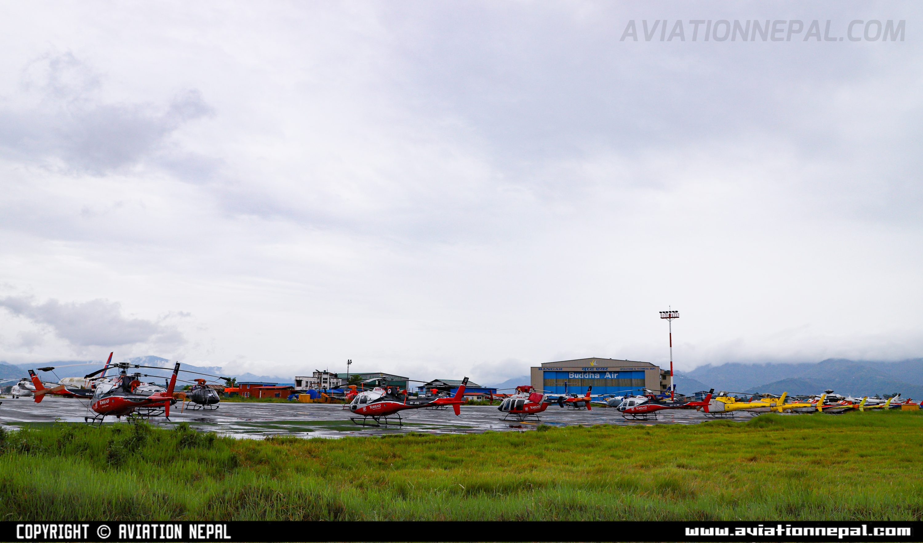 Airplanes and Helicopters on the tarmac of the Tribhuvan International ...